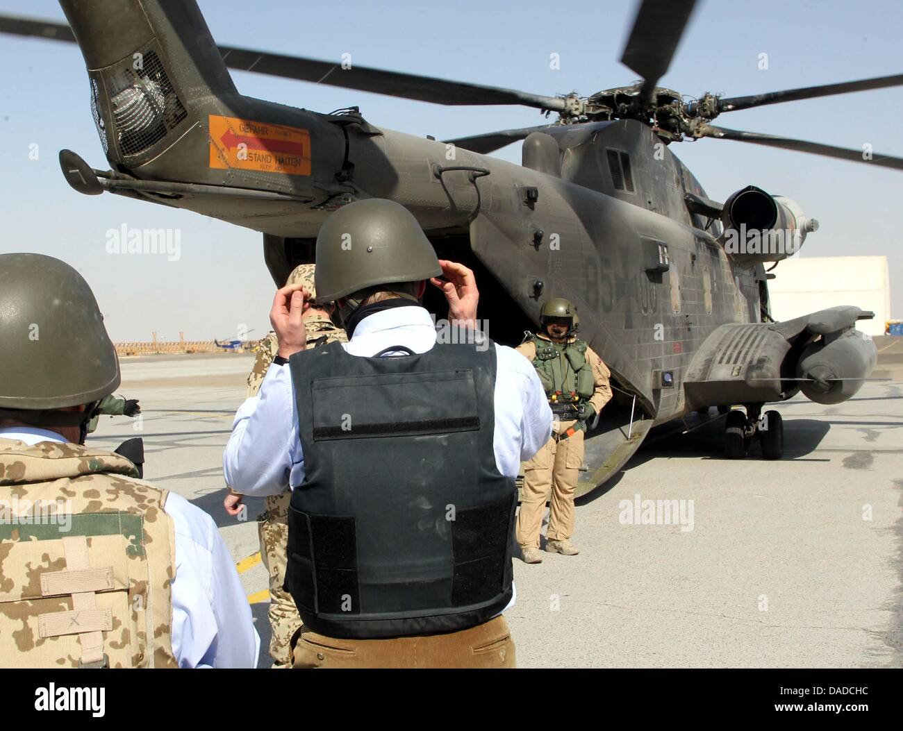 Dressed with helmet and protective vest German President Christian ...