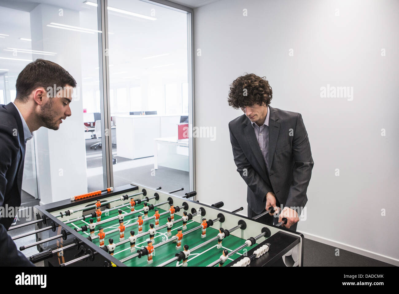 Table football playing hi-res stock photography and images - Alamy
