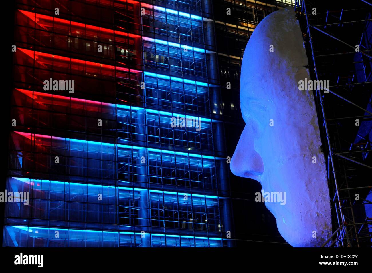 A giant mask is illuminated at Potsdamer Platz on the occassion of the ...