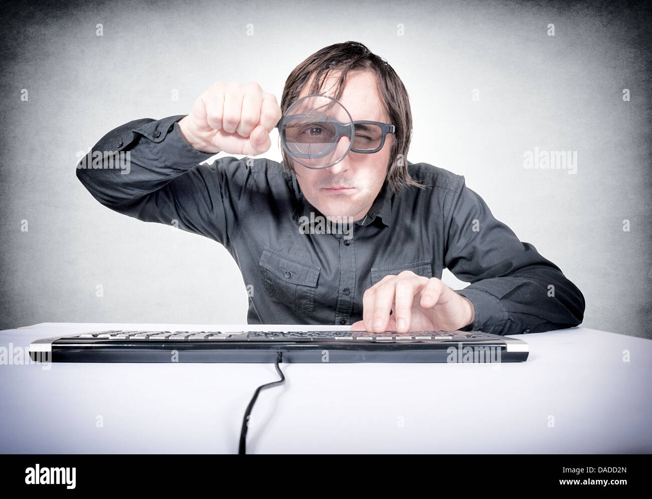 Searching concept with the man holding magnifier Stock Photo - Alamy Searching concept with the man holding magnifier Stock Photo - Alamy