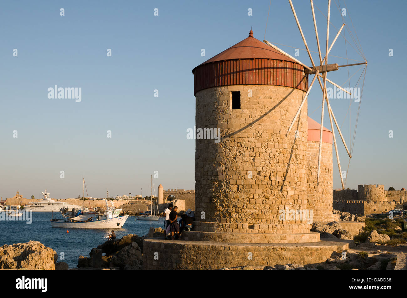 Medieval windmills at Mandraki port of Rhodes, Greece Stock Photo - Alamy