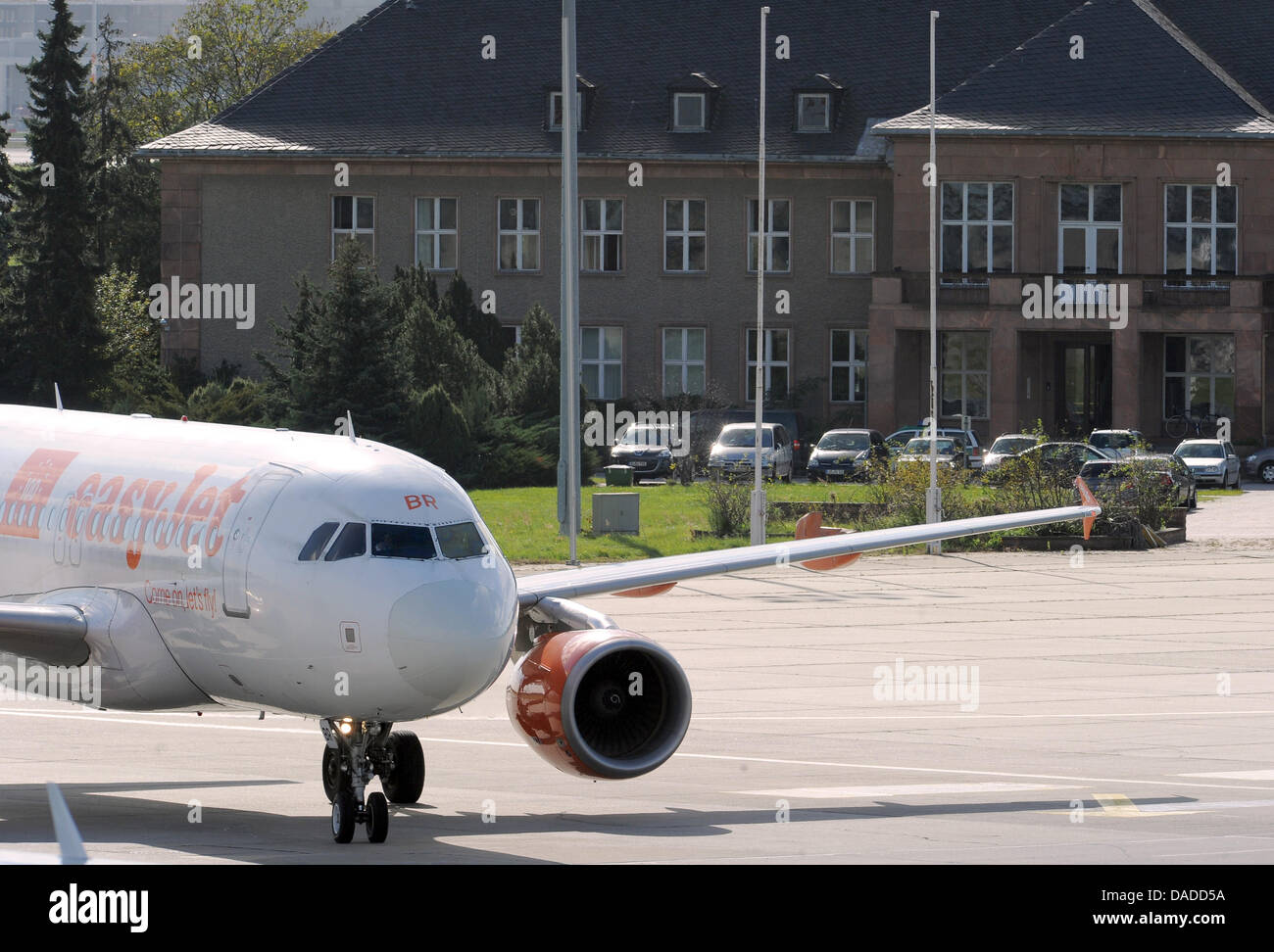 An airbus rolls past the former air terminal for East German ...