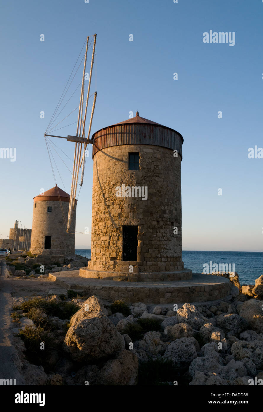 Medieval windmills at Mole of St Nicholas, Mandraki port of Rhodes ...