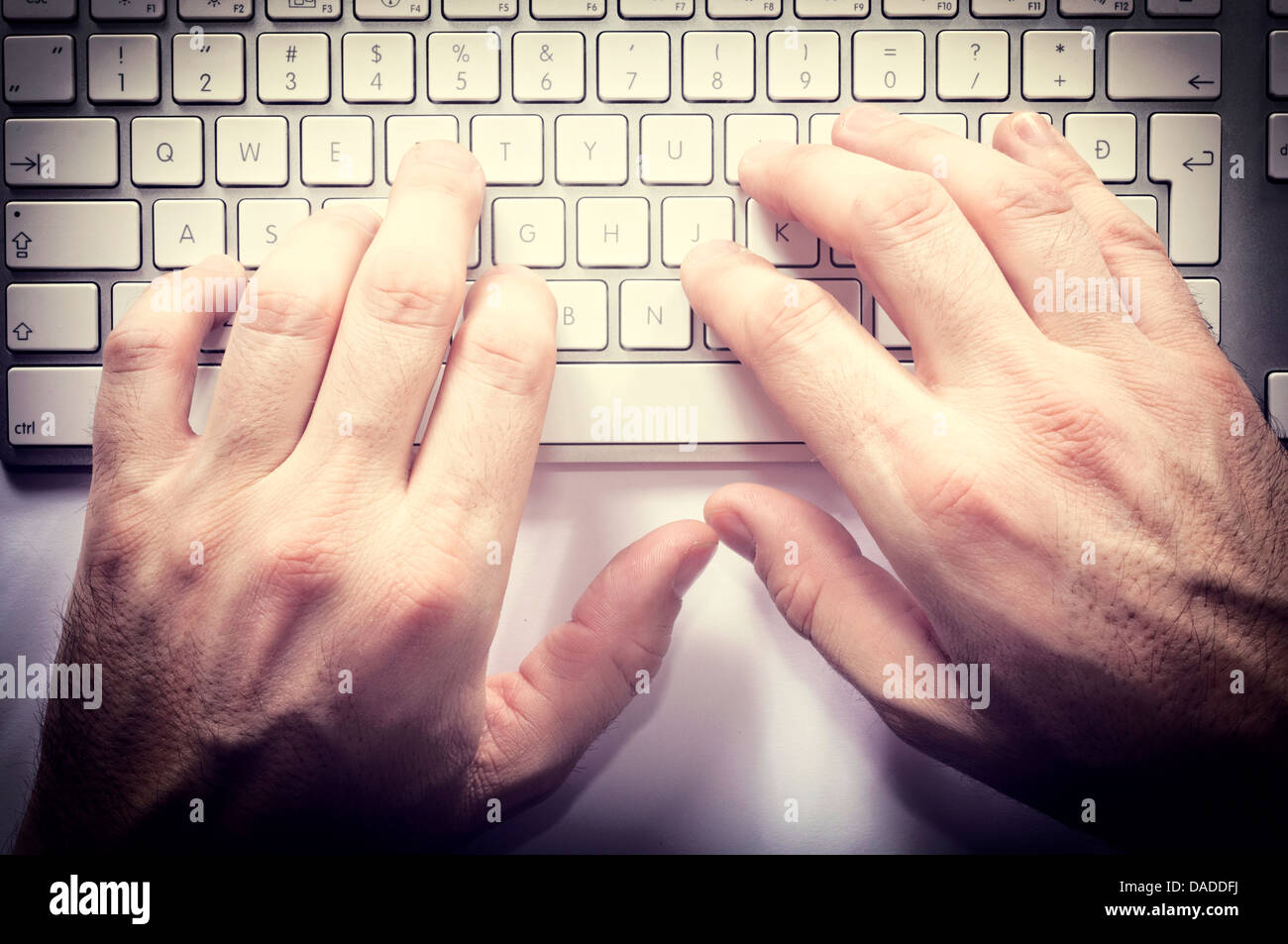 Typing hands on the keyboard from above Stock Photo - Alamy