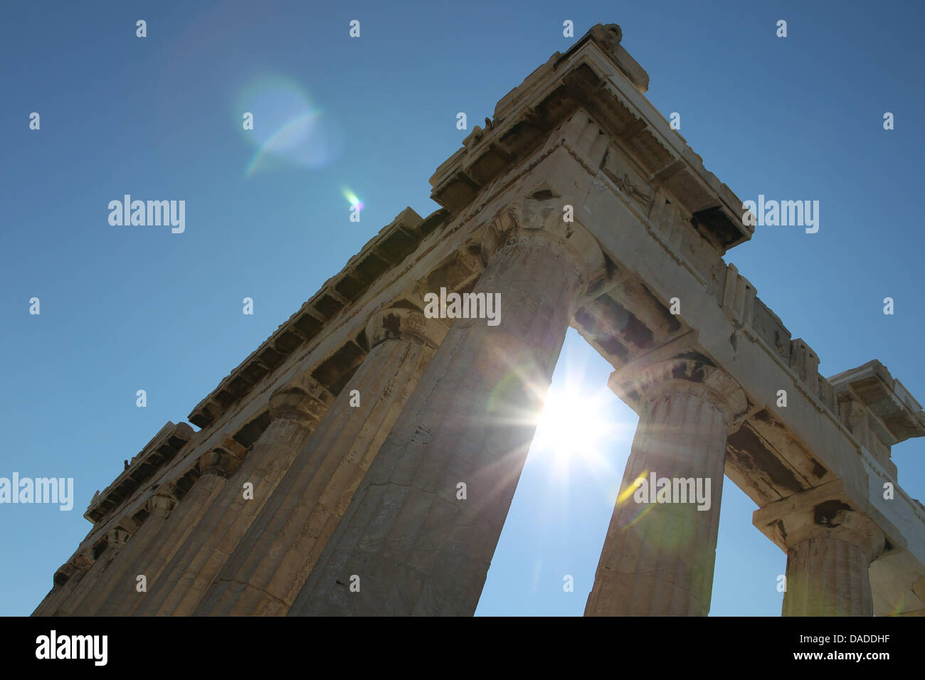 The sun shines through collumns of the Parthenon on the Acropolis in ...