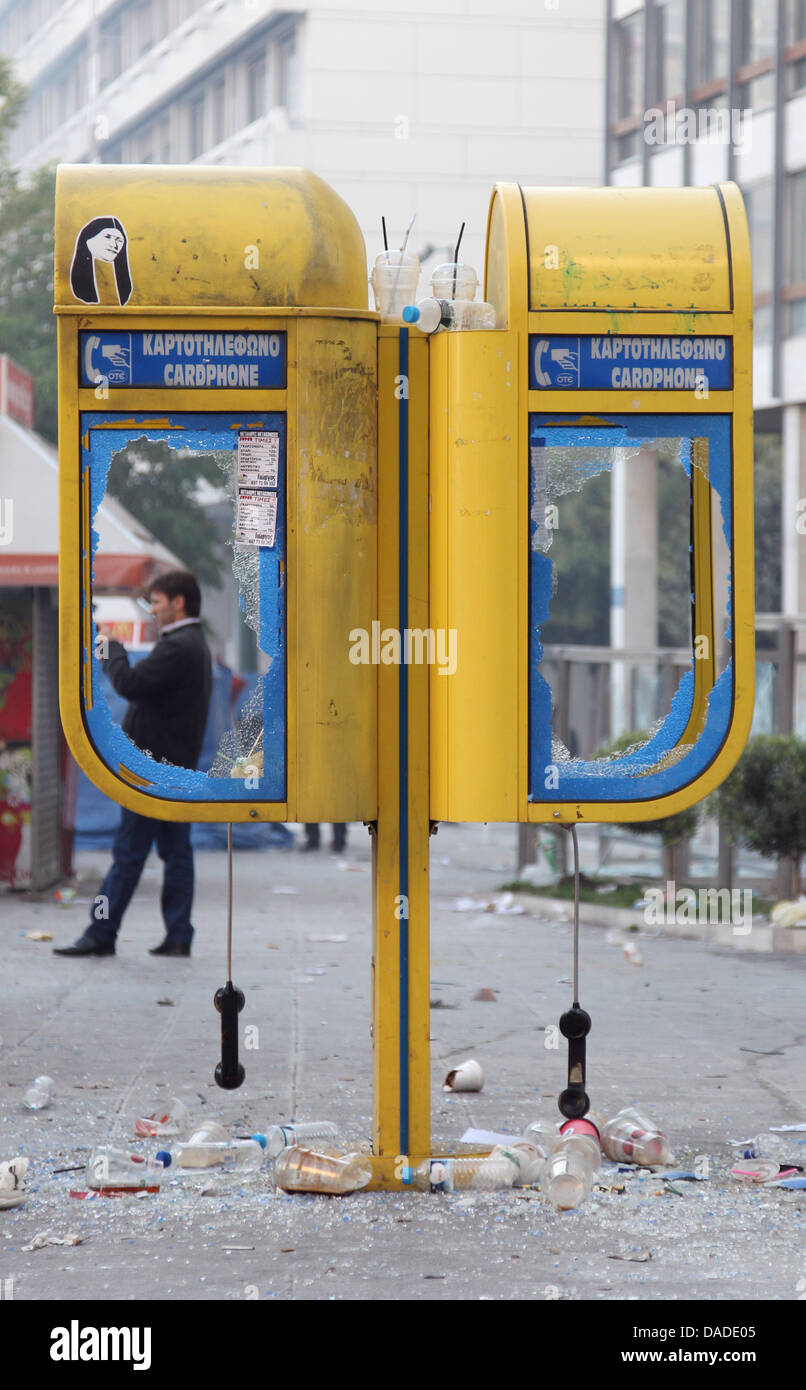 A destroyed telephone booth stands in Athens, Greece, 19 October 2011 ...