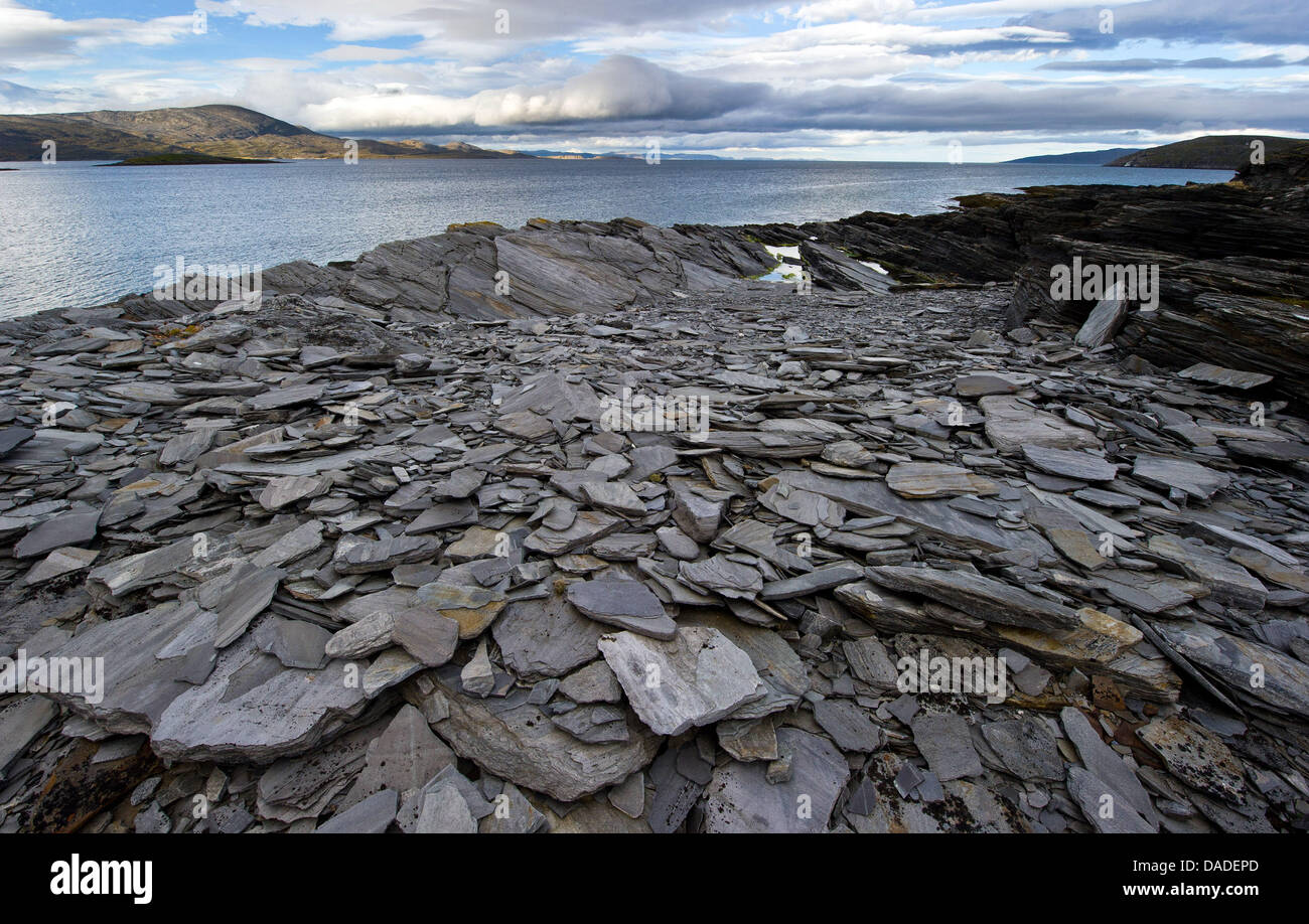 Bizarre rock formations border the coastline of the Arctic Sea near the ...