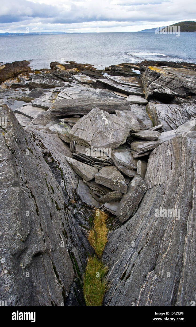 Bizarre rock formations border the coastline of the Arctic Sea near the ...