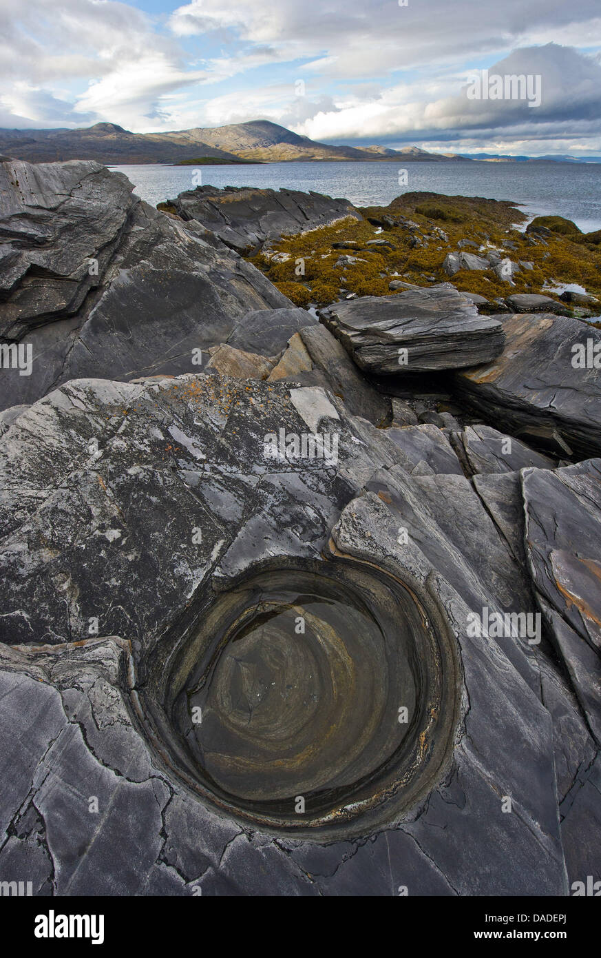 Bizarre rock formations border the coastline of the Arctic Sea near the ...