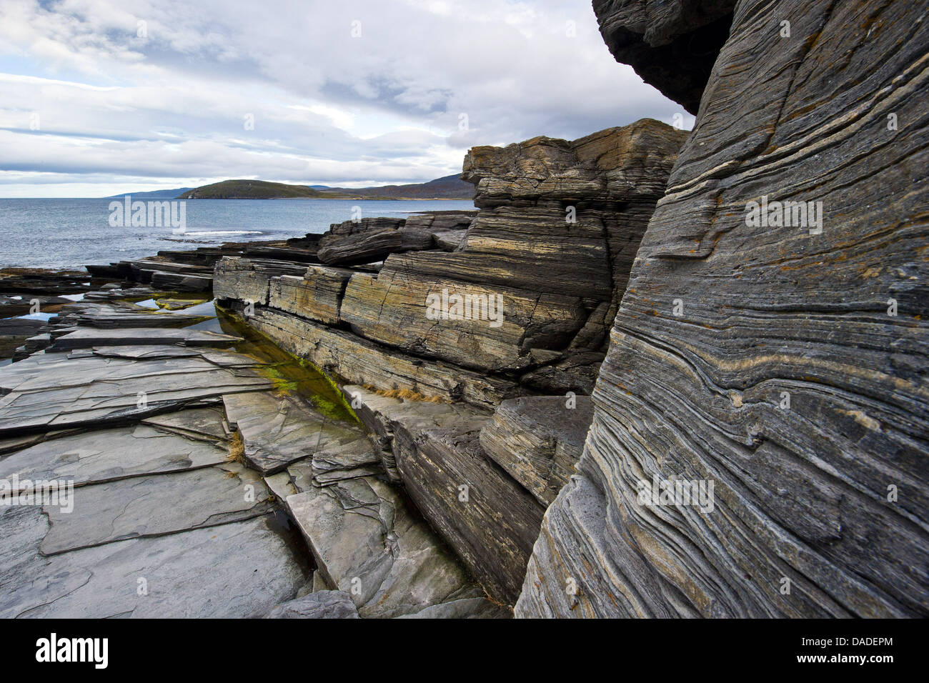 Bizarre rock formations border the coastline of the Arctic Sea near the ...