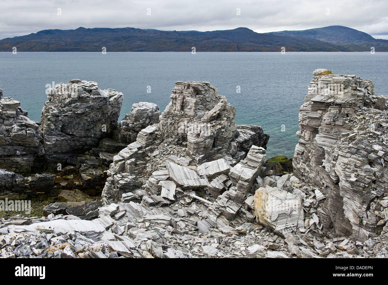 Bizarre rock formations border the coastline of the Arctic Sea near the ...