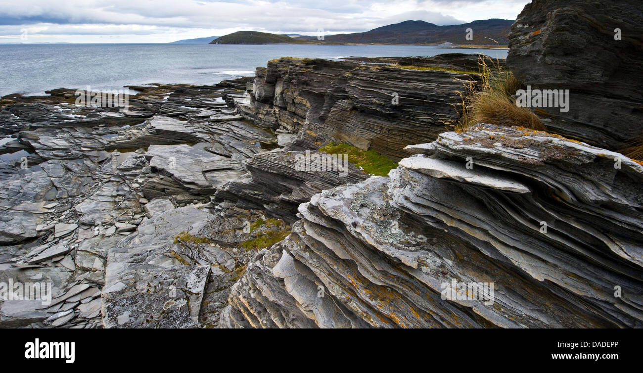 Bizarre rock formations border the coastline of the Arctic Sea near the ...