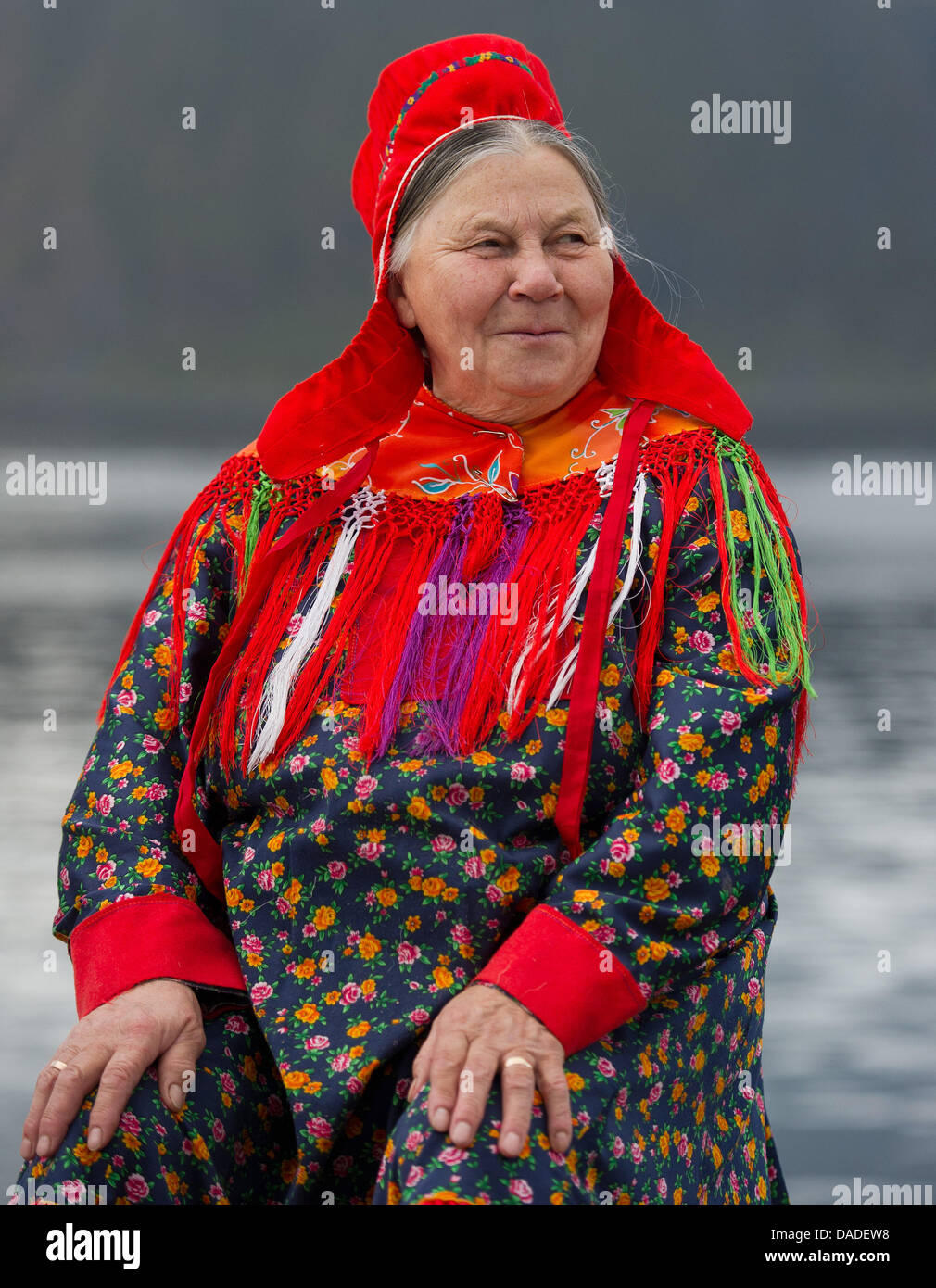 An elderly lady of the indigenous Sami people wears a traditional dress ...