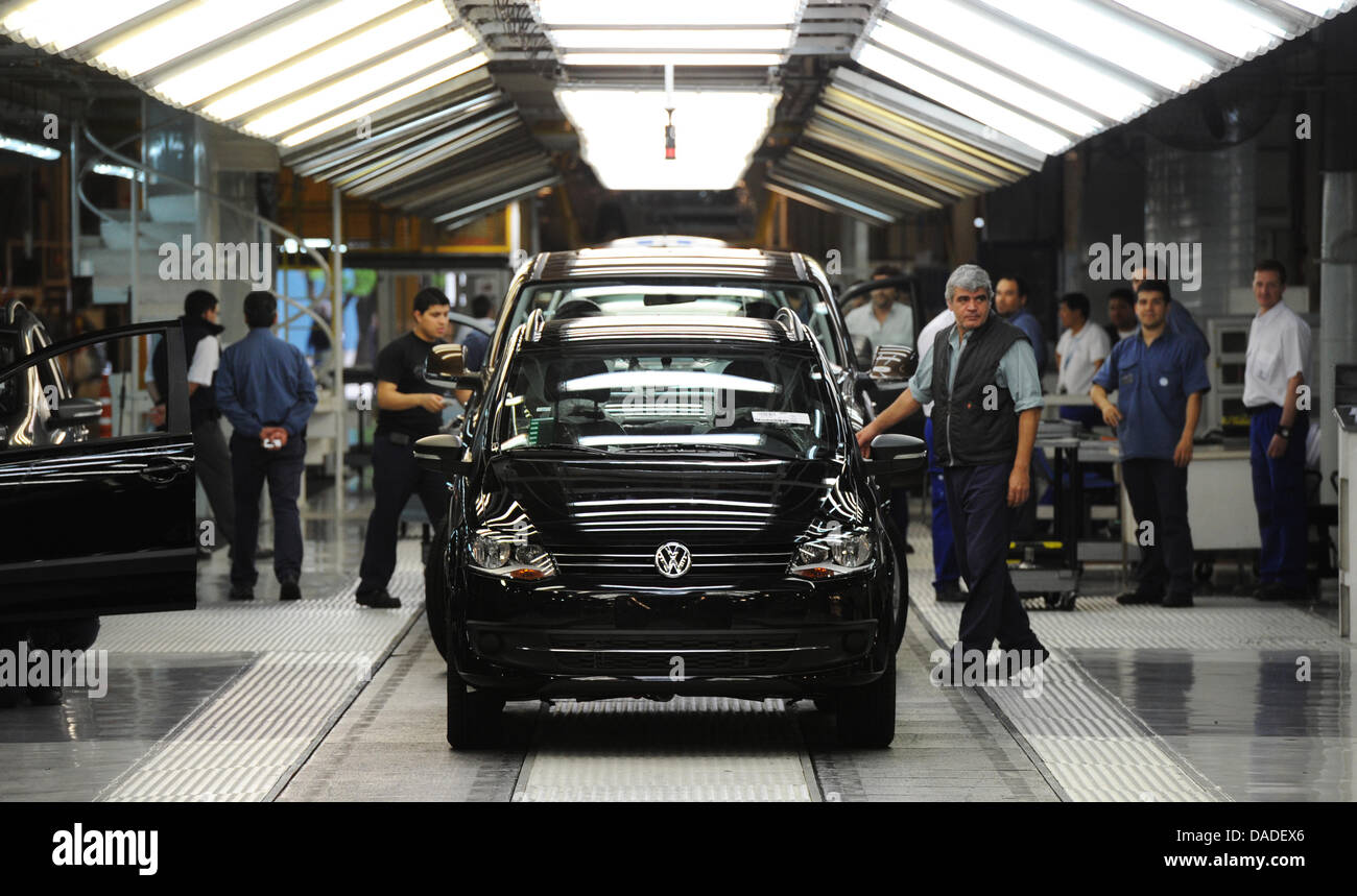 Workers assemble different VW cars at the Volkswagen plant in General ...