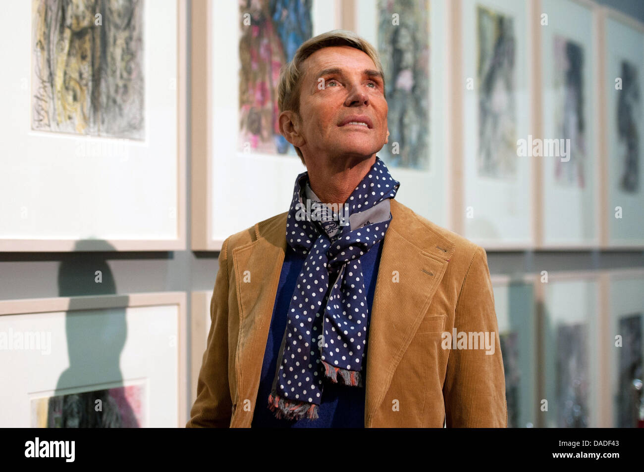 German fashion designer Wolfgang Joop stands next to a selection of his ...