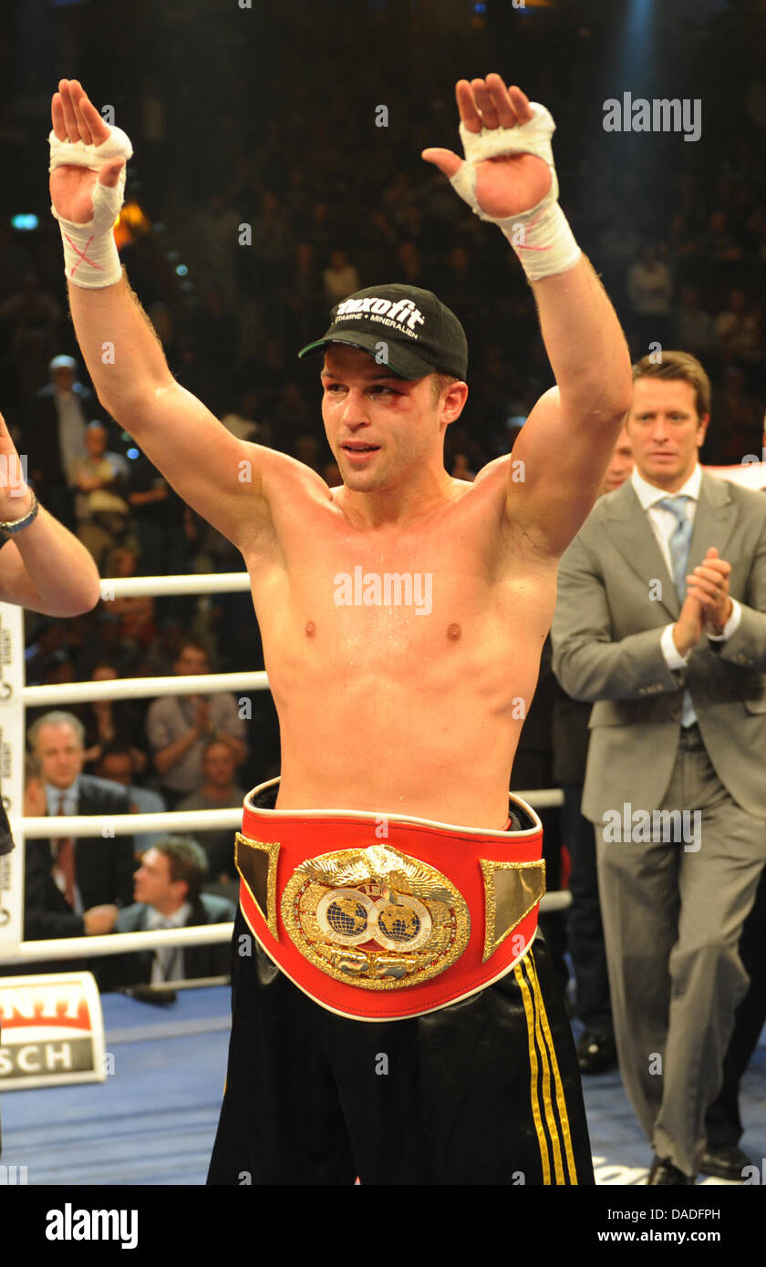 German middleweight boxer Dominik Britsch celebrates his victory in ...