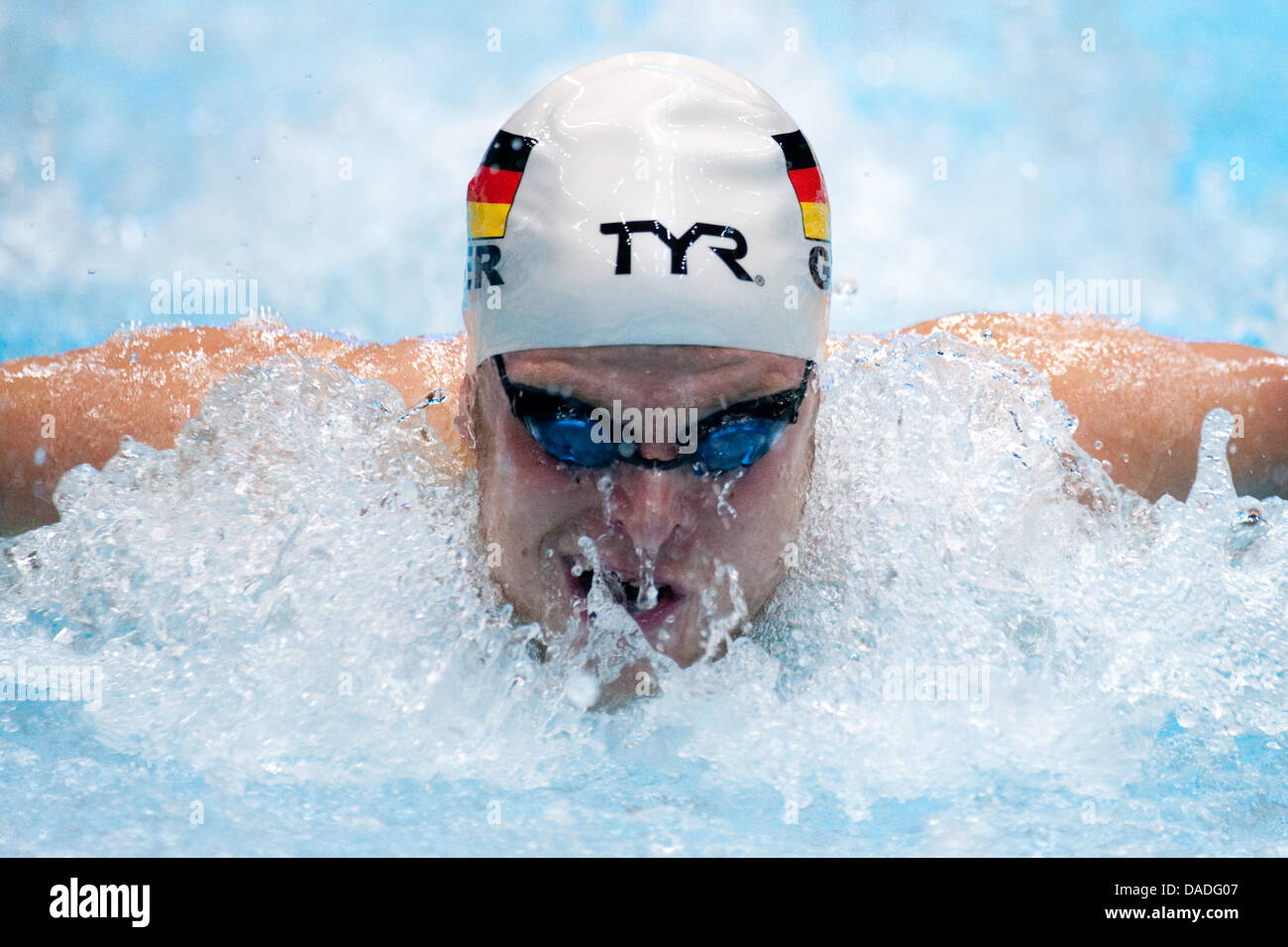 German swimmer Steffen Deibler swims the men's 100 meter butterfly ...