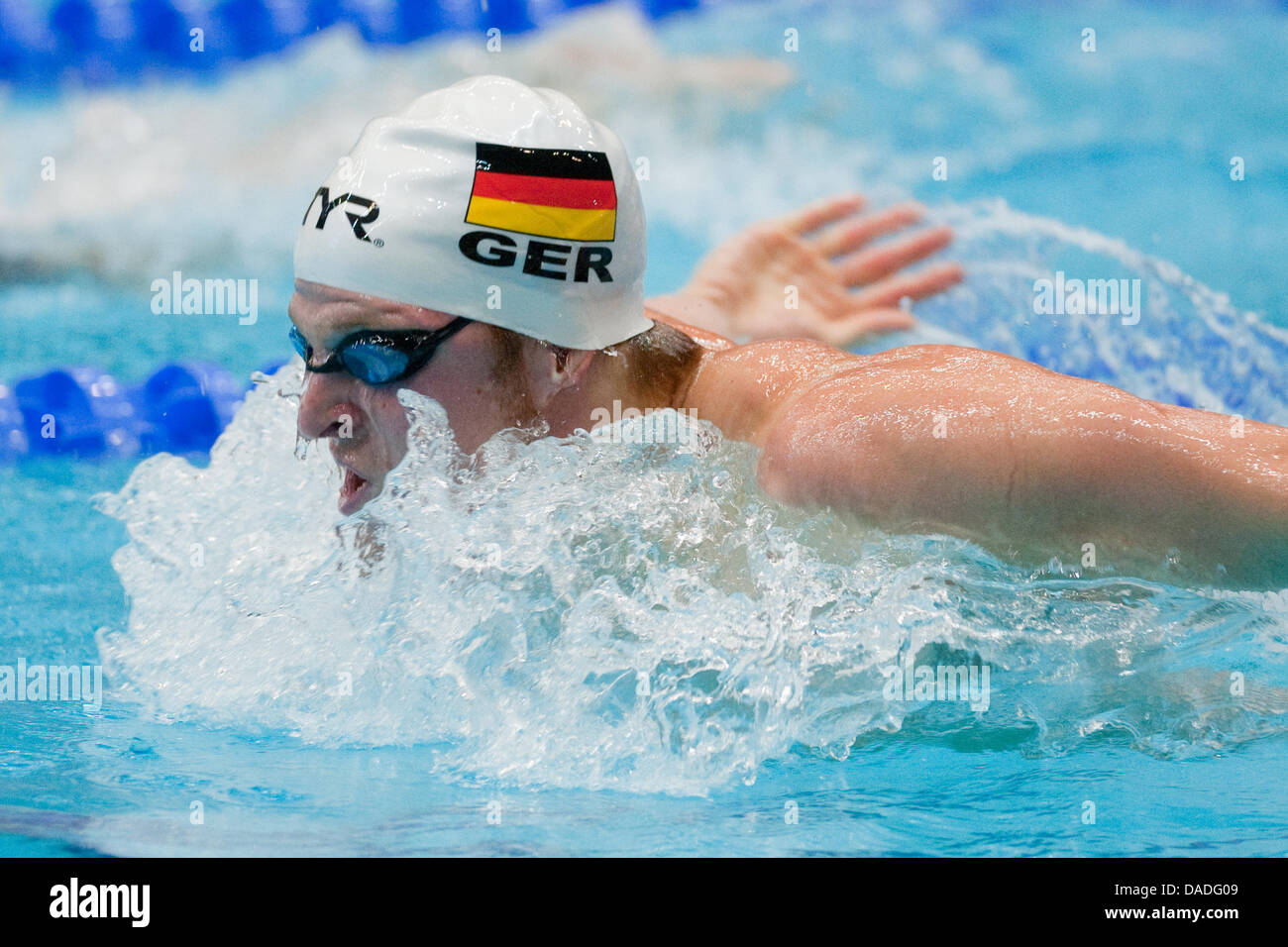 German swimmer Steffen Deibler swims the men's 100 meter butterfly ...
