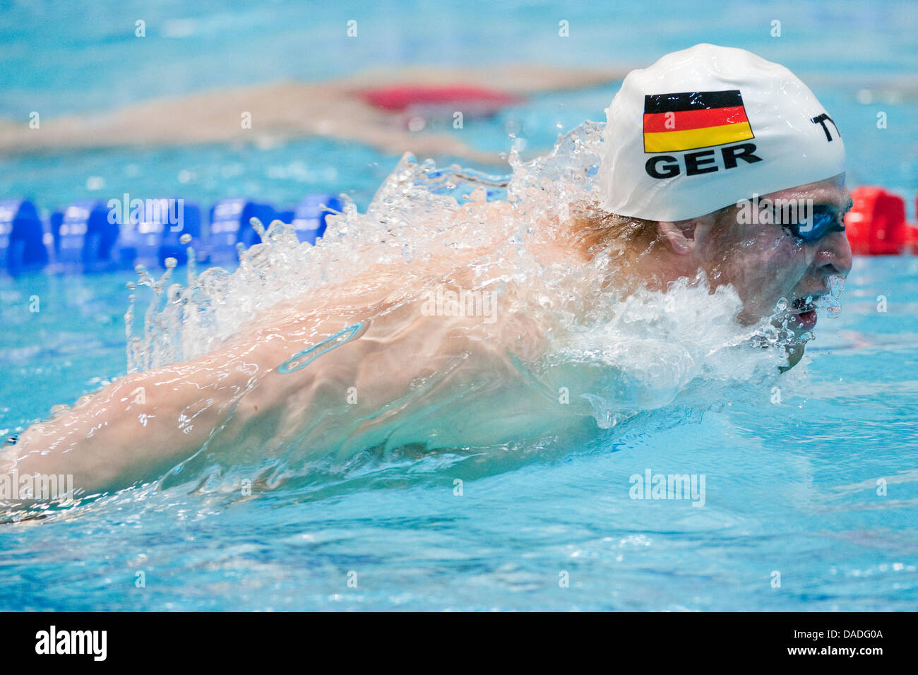 German swimmer Steffen Deibler swims the men's 100 meter butterfly ...