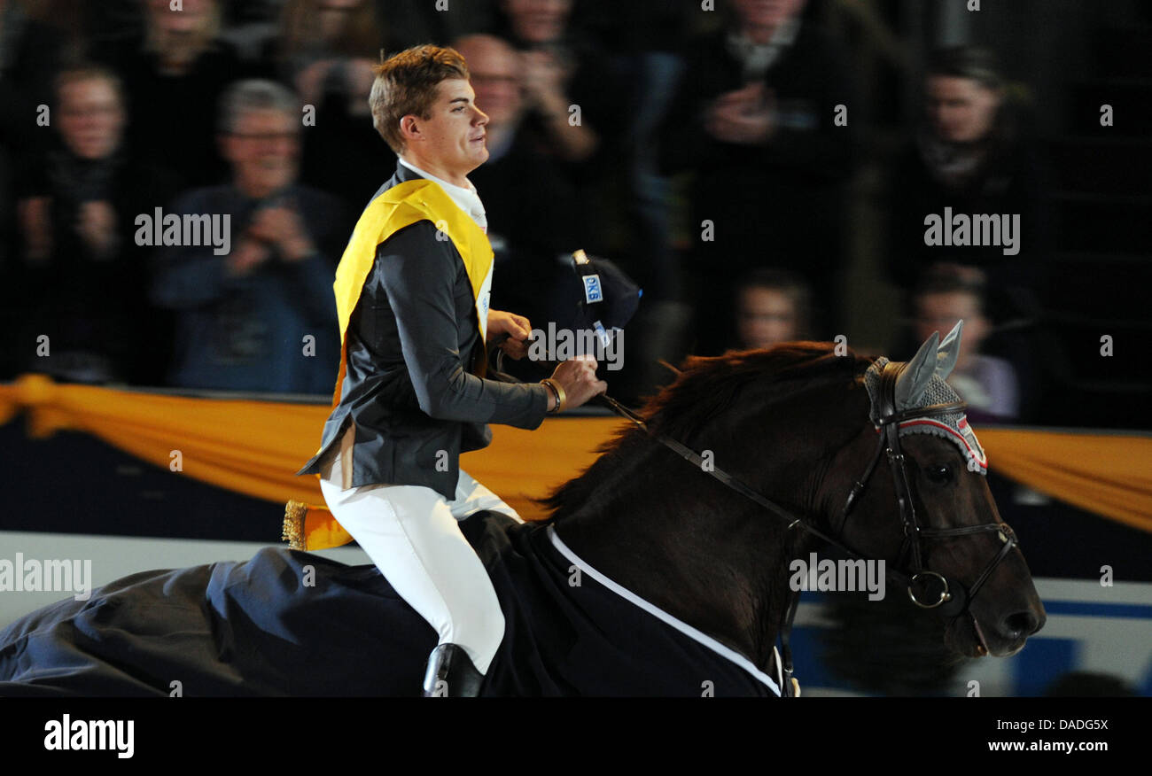 The German equestrian Joerg Oppermann cheers about his victory on his ...