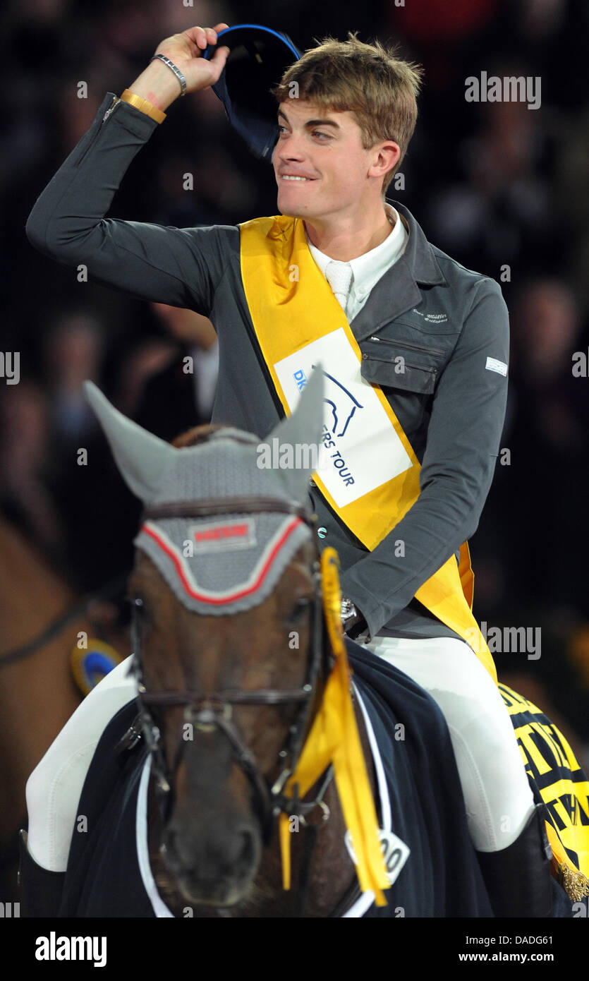 The German equestrian Joerg Oppermann cheers about his victory on his ...