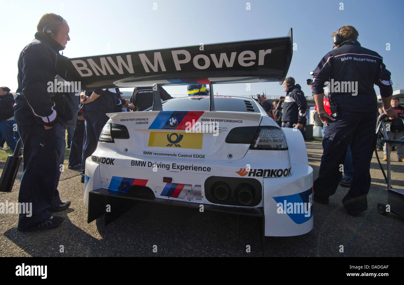 Mechanics work on the new German Touring Car Masters BMW M3 race car ...