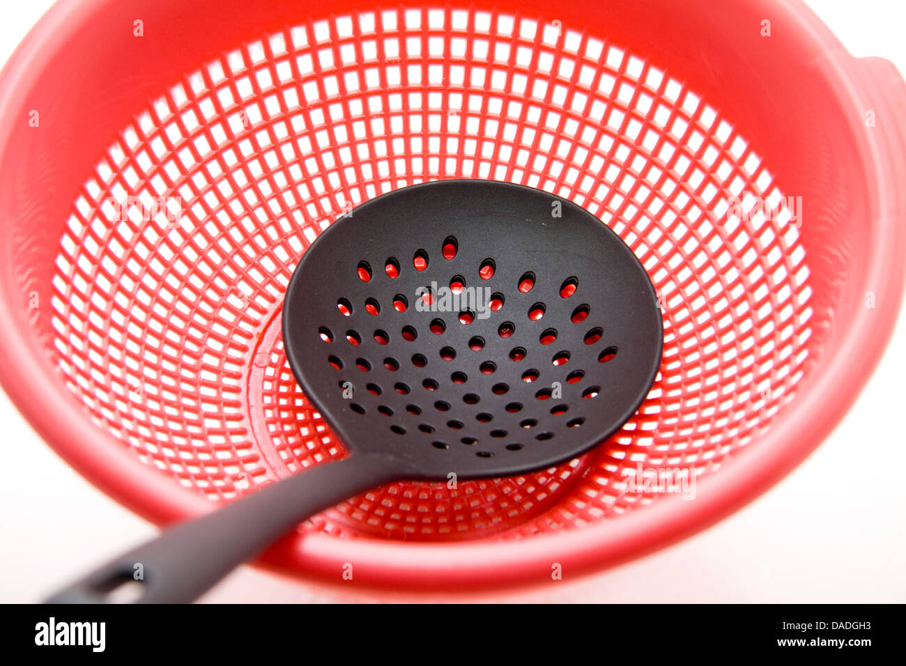Kitchen sieve with skimmer Stock Photo - Alamy