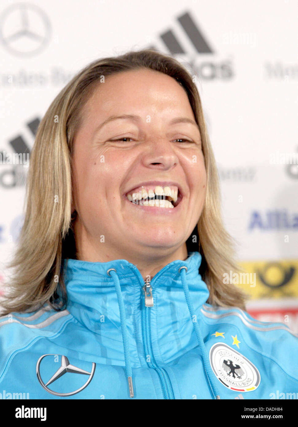 German women's national soccer player Inka Grings smiles during a press ...