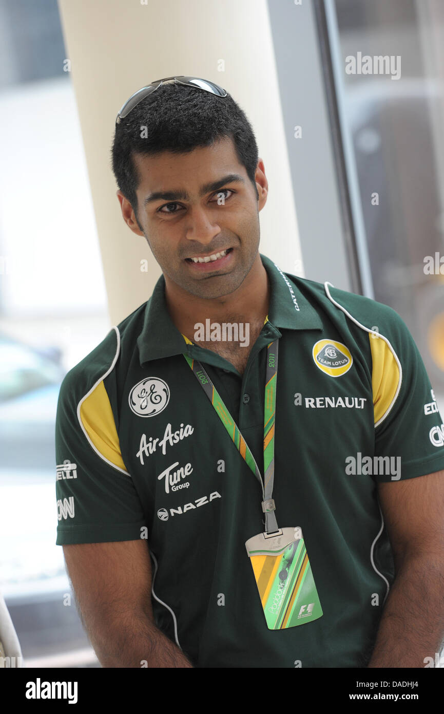Indian Formula One testdriver Karun Chandhok smiles in the paddock at ...