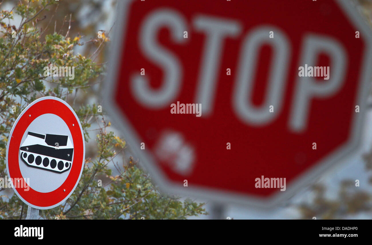 View of a self-made prohibition sign for tanks behind a stop sign at ...