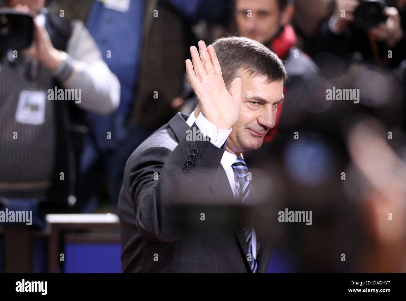 Prime Minister of Estonia Andrus Ansip waves upon his arrival in ...