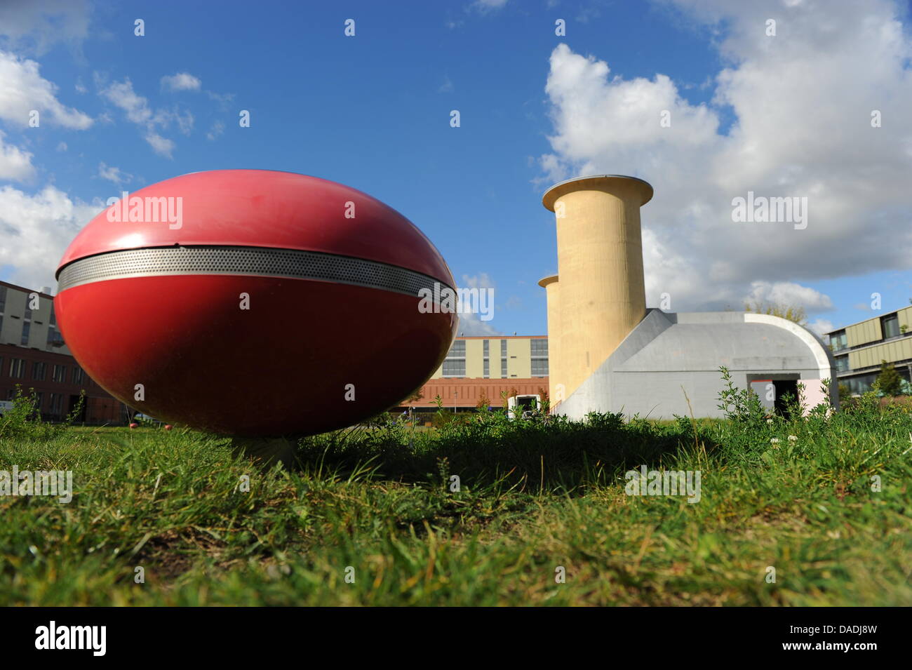 A red elliptical object that is a part of the sound installation AIR ...