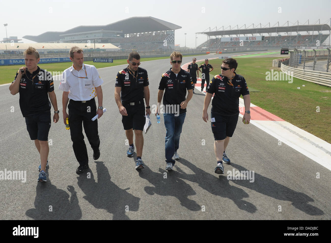 Physiotherapeut Tommi Pärmäkoski (L-R), a Renault engineer, race ...