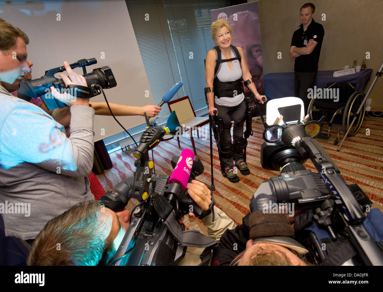 American paraplegic "test pilot" Amanda Boxtel walks with the wearable ...