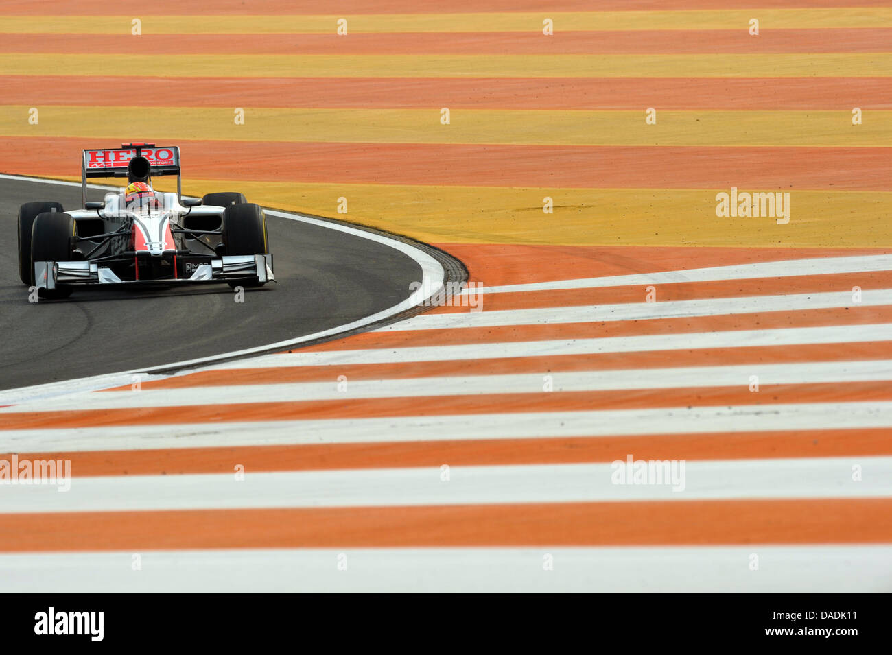 Indian Formula One driver Narain Karthikeyan of HRT steers his car ...