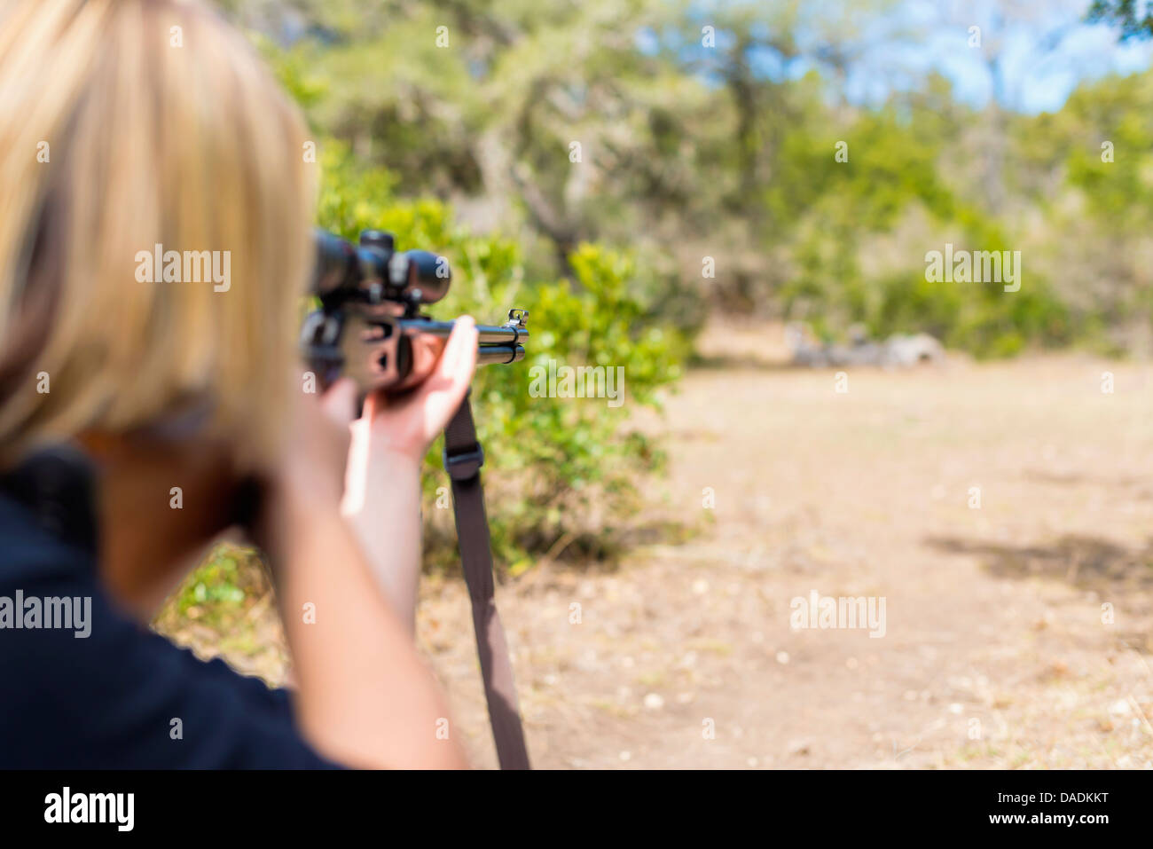 USA, Texas, Young woman shooting hunting rifle Stock Photo - Alamy
