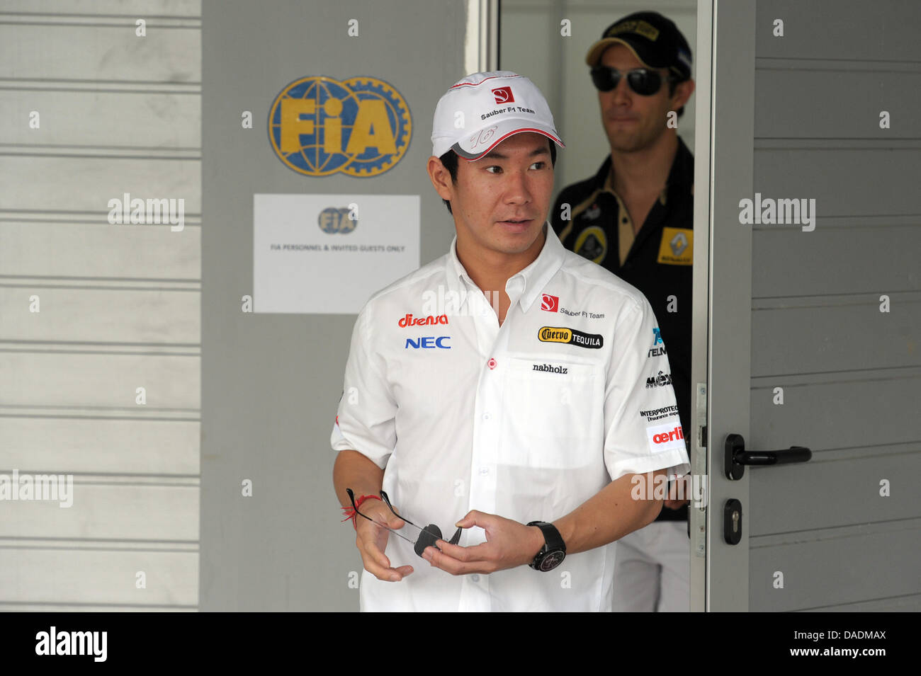 Japanese Formula One driver Kamui Kobayashi of Sauber (L) and Brazilian ...