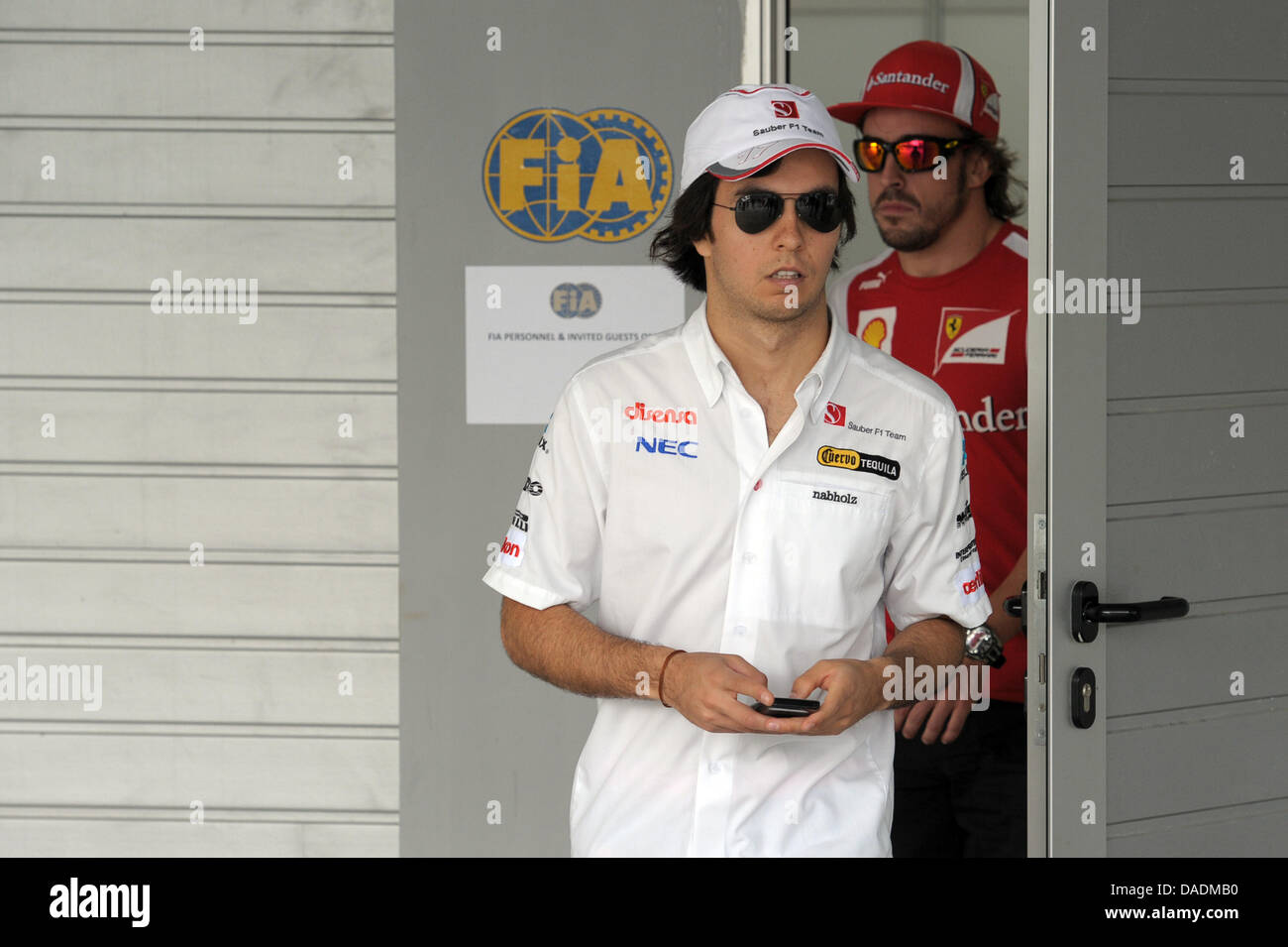 Mexican Formula One driver Sergio Perez of Sauber (L) and Spanish ...