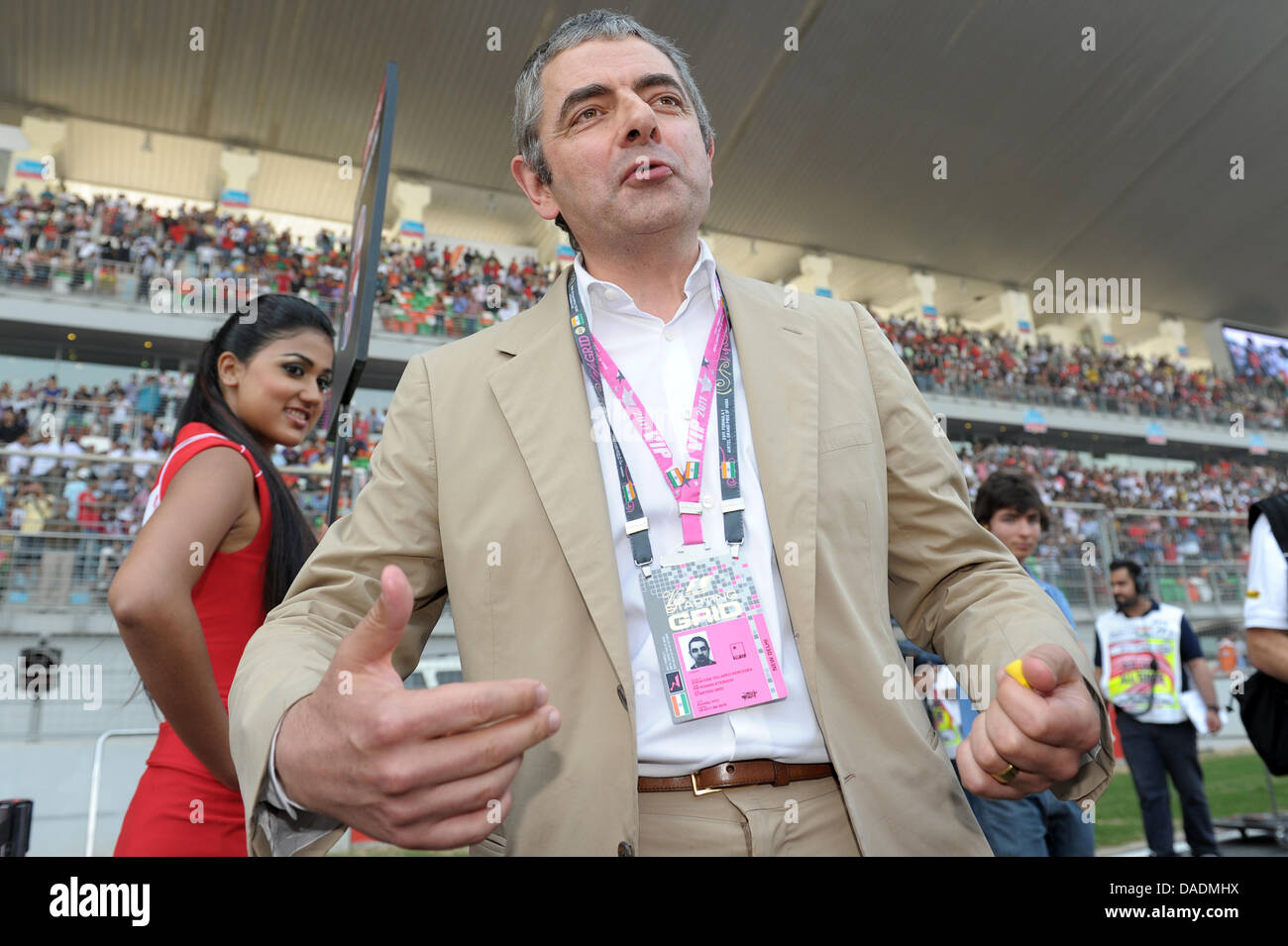 British comedian Rowan Atkinson walks through the grid just before the ...