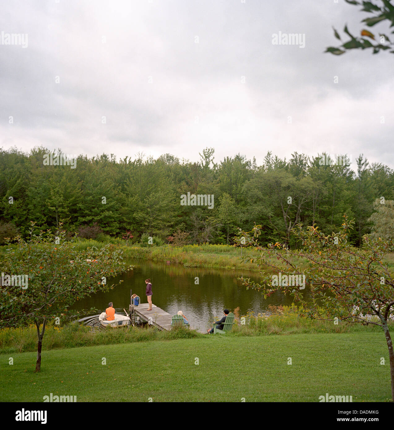 Family gathering by the lake Stock Photo - Alamy