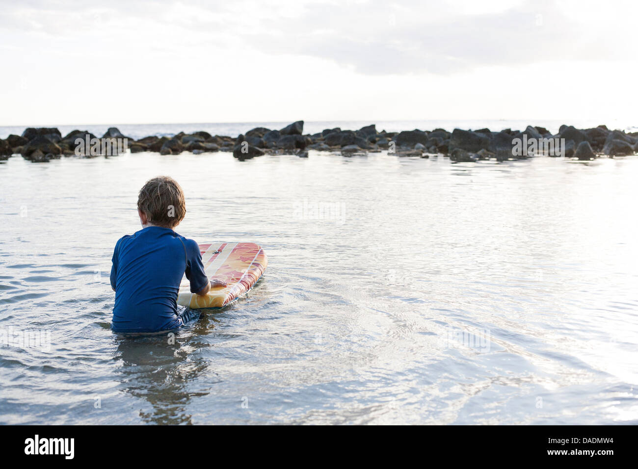 Young boy with bodyboard hi-res stock photography and images - Alamy