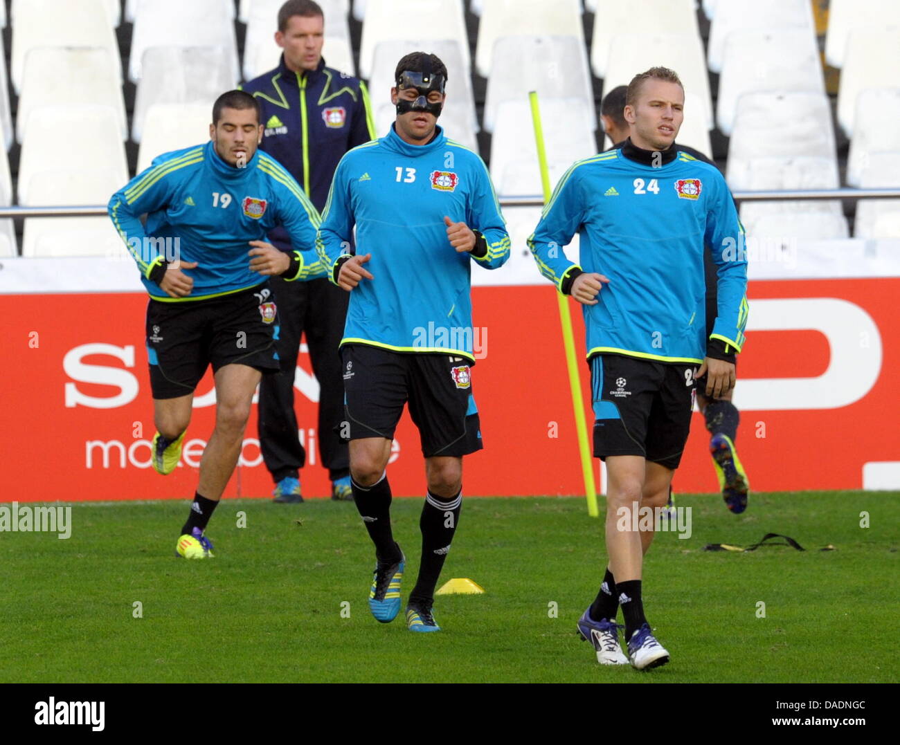 Leverkusen's Michal Kadlec (R-L), Michael Ballack, with a face mask ...