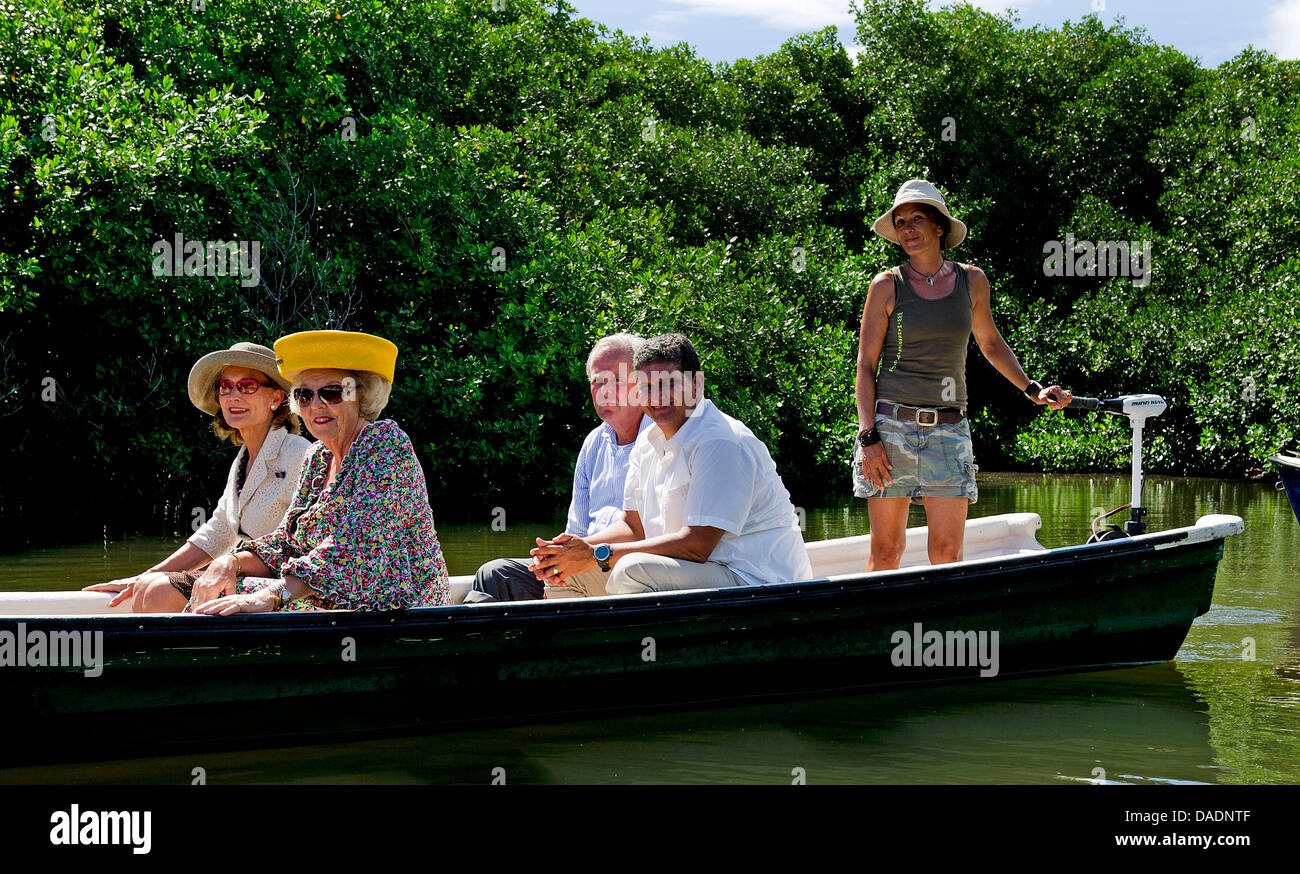 Dutch Queen Beatrix (2nd L) during a boat trip through mangroves at Lac ...