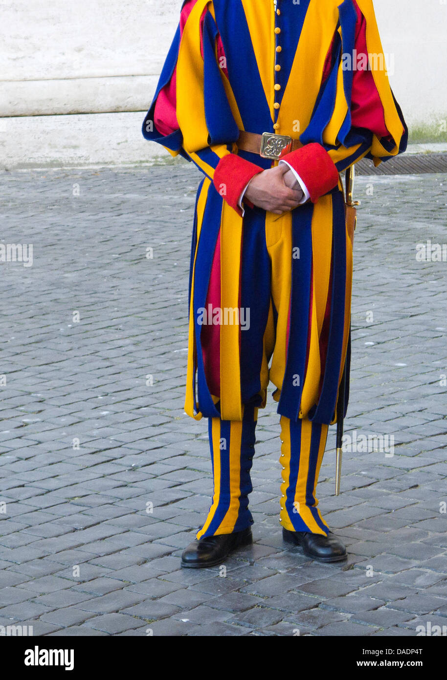 A Swiss Guard in traditional uniform stands in Vatican City, Vatican ...