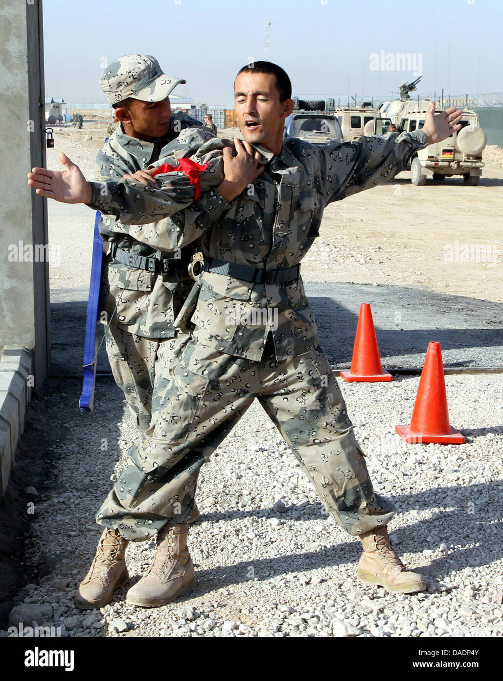 Two officers do drills at the Police Training Camp (PTC) in Mazar-i ...