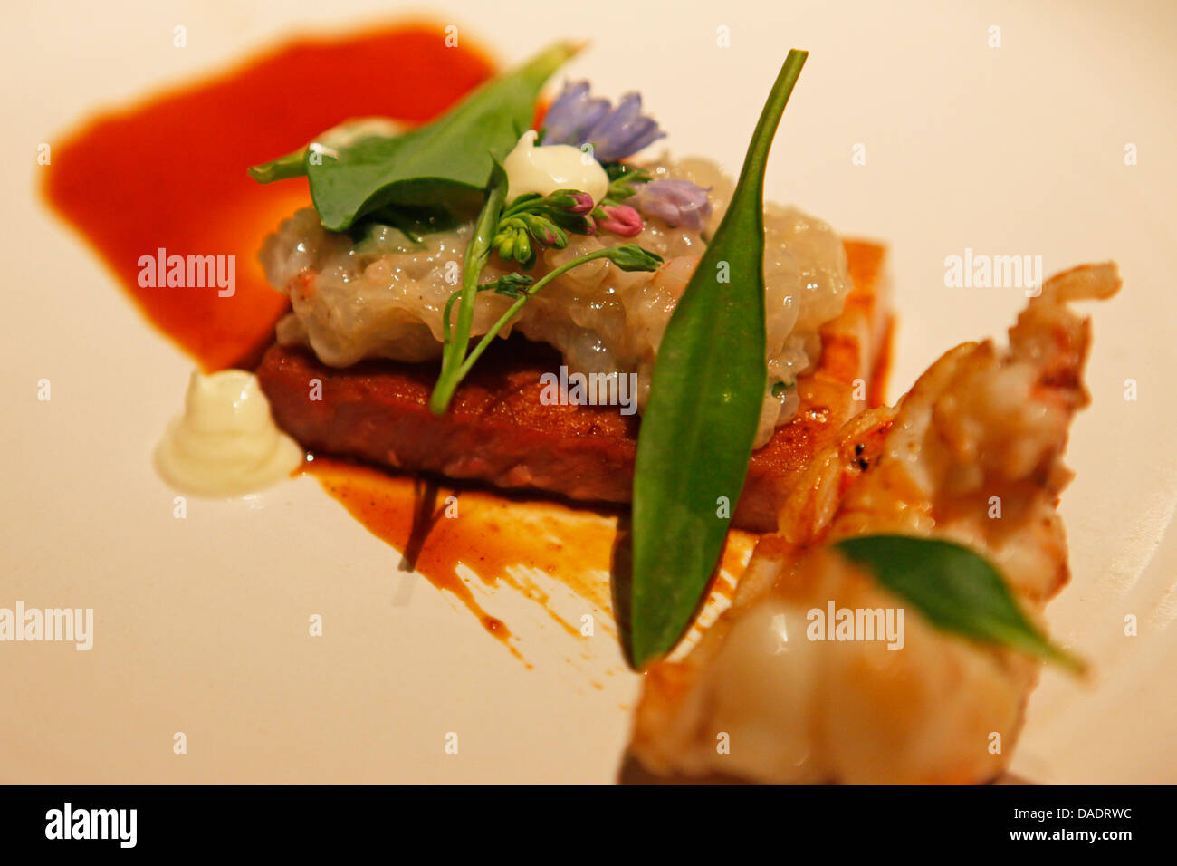An attractively presented appetizer topped with fish roe and edible ...