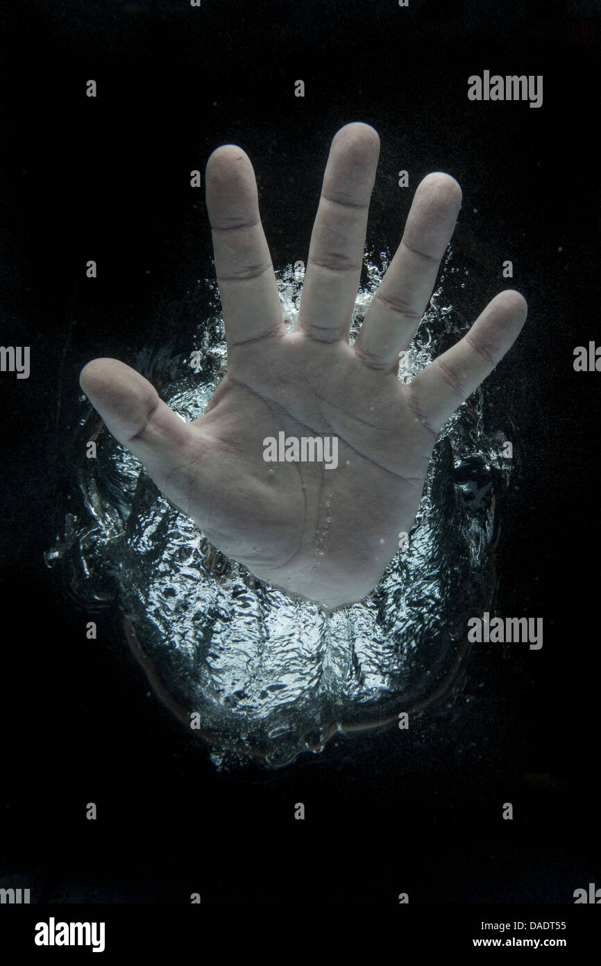 Open hand beneath water Stock Photo - Alamy