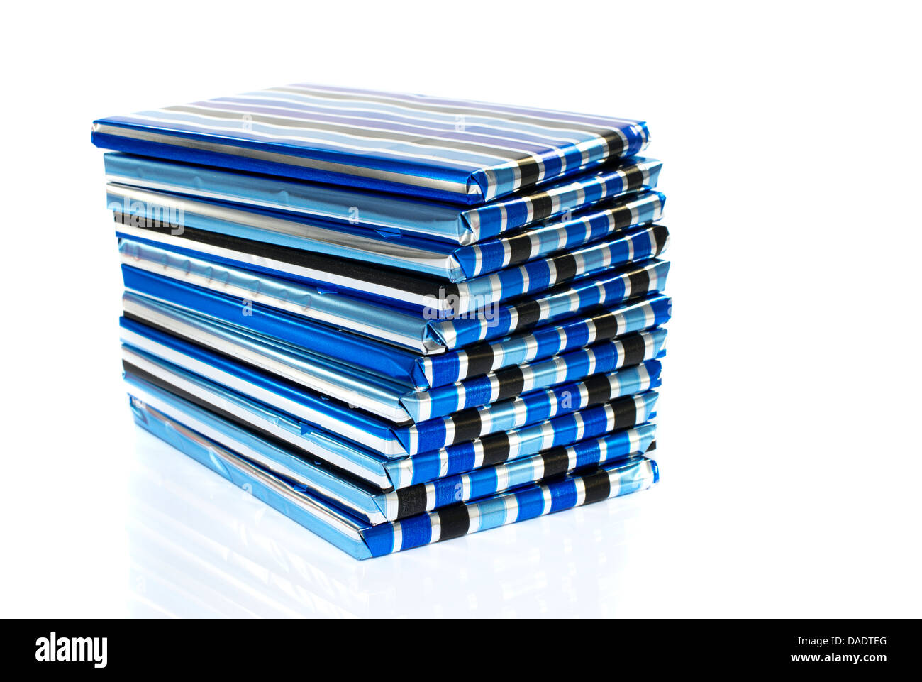 stack of presents in blue silver and black isolated on white background ...