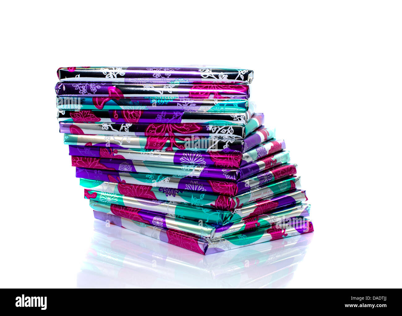 stack of presents in pink silver and green isolated on white background ...