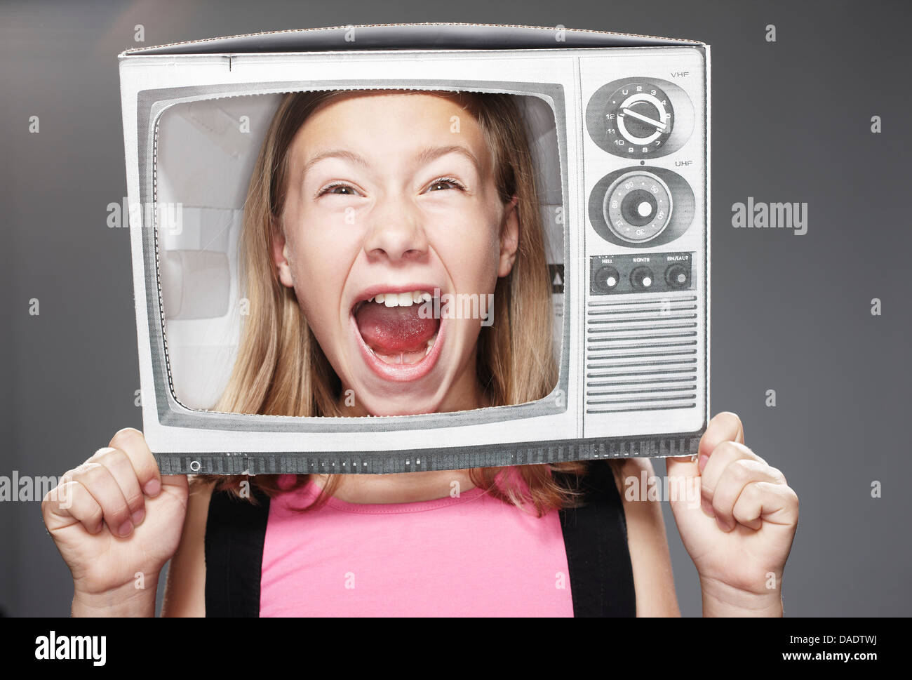 Girl screaming in paper TV against grey background Stock Photo - Alamy